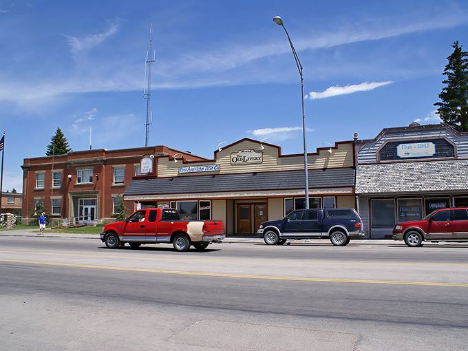 Main Street Driggs – where Norman Rockwell meets mountain majesty. Those green lampposts and American flags aren't just decoration; they're a promise of small-town authenticity.