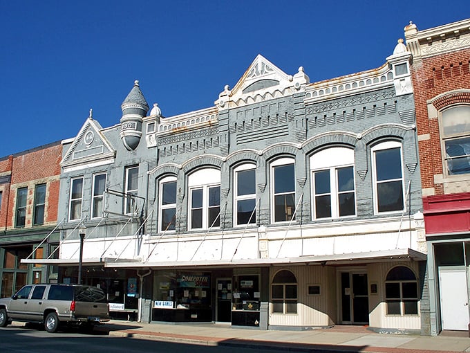 Colorful facades tell stories of a bygone era along Delphos's Main Street, where historic architecture meets small-town charm under impossibly blue Ohio skies.