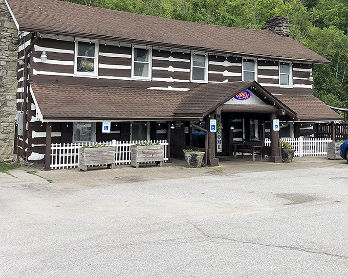 The Log Cabin Inn's exterior is exactly what Kentucky comfort food deserves—authentic log construction that promises zero pretension and maximum flavor.