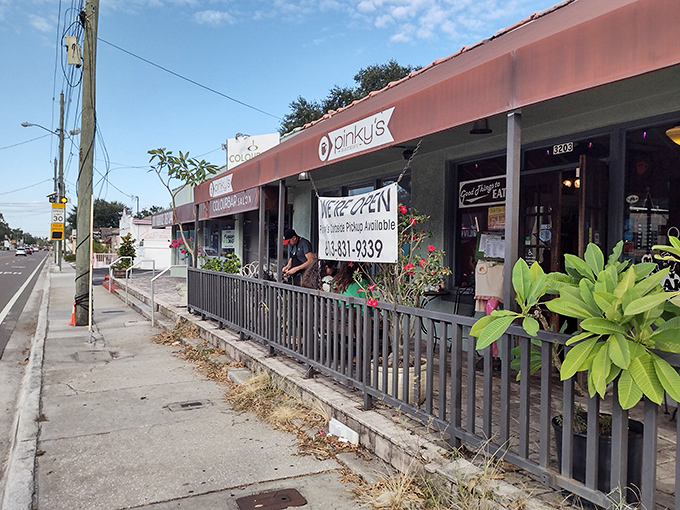 The unassuming pink storefront might not scream "culinary destination," but locals know this Tampa treasure is worth slamming on the brakes for.