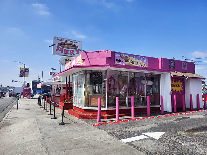 That bright pink exterior isn't just decoration – it's a beacon calling hot dog pilgrims from across California.