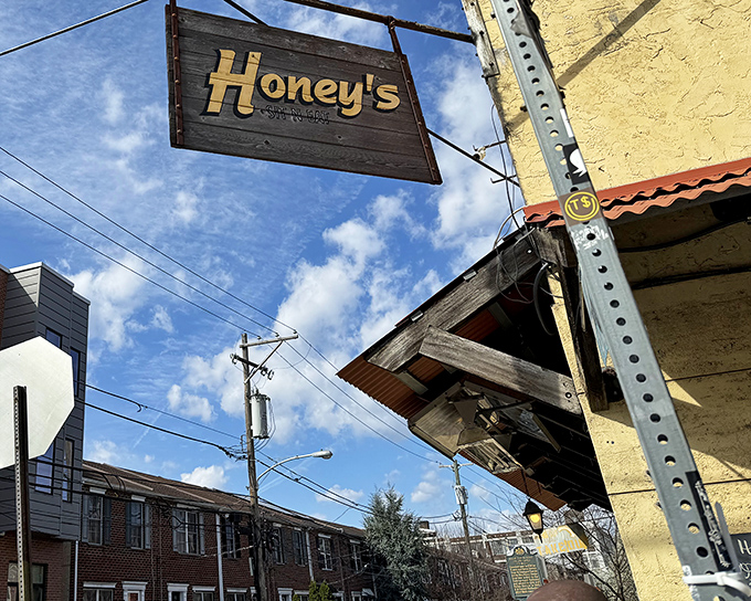 That weathered wooden sign hanging above Honey's entrance isn't just decoration—it's a beacon for breakfast enthusiasts seeking Philadelphia's best-kept culinary secret.