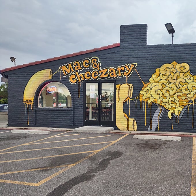 The blue building with dripping yellow cheese art isn't subtle about its mission. Like a cheese-themed Bat Signal calling comfort food lovers home.