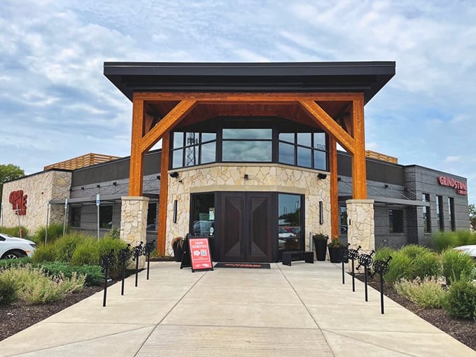 The stone and timber façade of Grindstone on the Monon stands like a welcoming beacon for hungry travelers. Rustic elegance meets Hoosier hospitality at first glance.