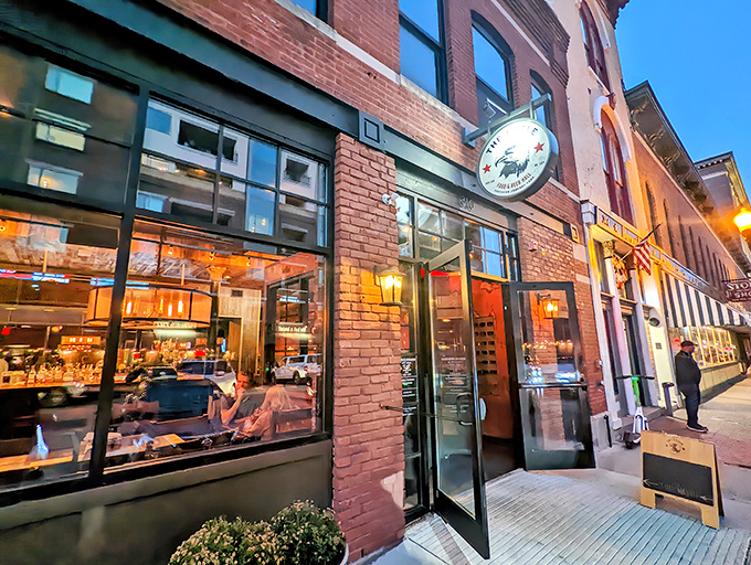 The Eagle's brick exterior on Mass Ave beckons hungry patrons like a siren song. That line forming outside? Consider it a preview of deliciousness to come.