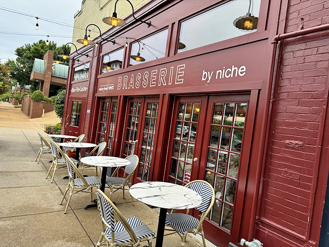 The burgundy façade with charming sidewalk seating whispers "bonjour" to Central West End passersby, promising Parisian pleasures without the passport hassle.