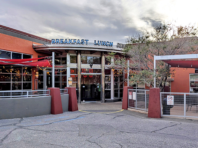 The iconic red exterior of Range Cafe beckons hungry travelers with its bold "BREAKFAST LUNCH DINNER" promise—a siren song for comfort food enthusiasts.