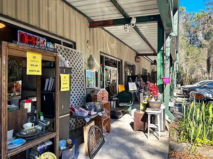 Spanish moss drapes over Sugar Bear Antiques like nature's welcome sign. This unassuming exterior holds treasures that would make Indiana Jones rethink his career path.