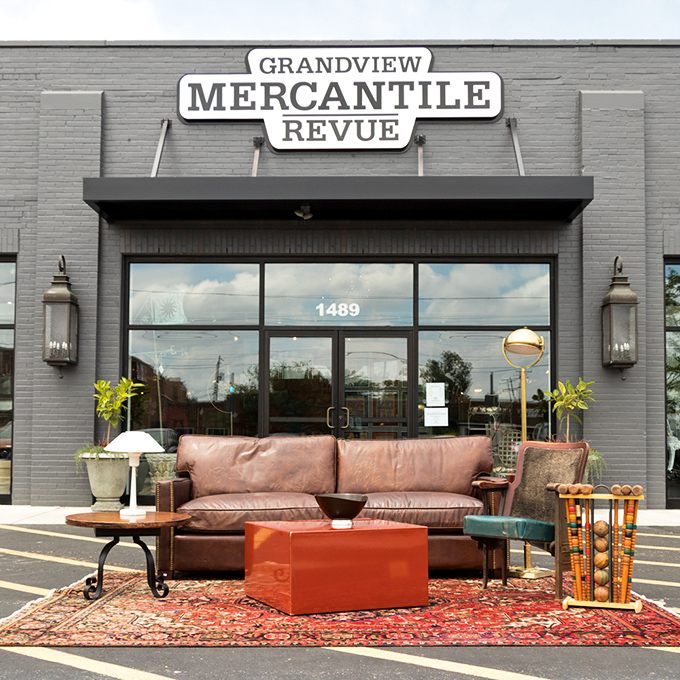 The storefront says "upscale consignment" but the sidewalk display screams "come sit a spell and imagine this in your living room."