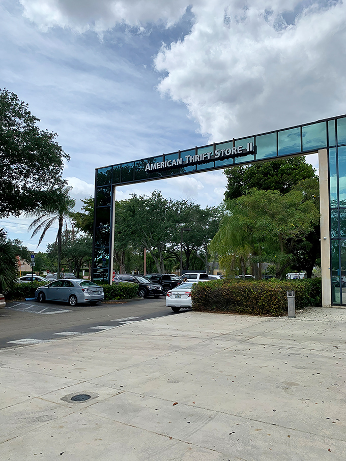 A modernist glass facade that houses treasures within—American Thrift Store stands like a crystal palace among Lauderhill's palm trees.