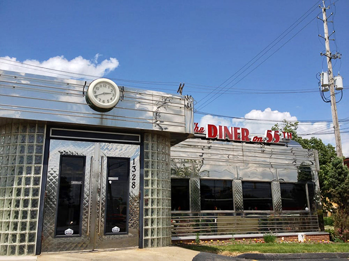 The gleaming stainless steel exterior of Diner on 55th stands like a time machine to the golden age of American dining. That vintage clock isn't just keeping time—it's preserving it.