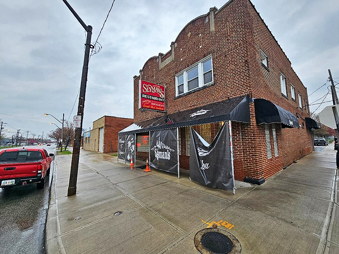 The unassuming brick exterior of Slyman's hides Cleveland's sandwich temple within. Like finding a treasure map in your attic—unremarkable until you realize what's inside.