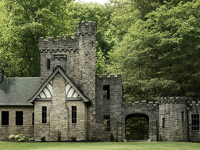 A medieval fantasy come to life—Squire's Castle stands proudly against a brilliant blue Ohio sky, its stone turrets and battlements defying Midwestern expectations.