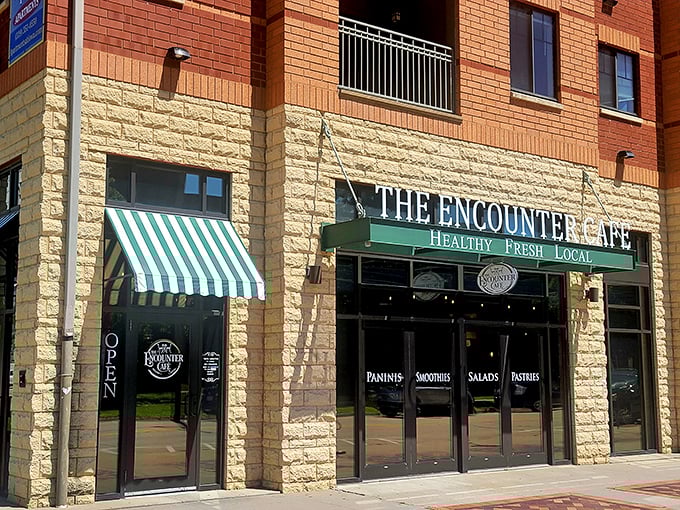 The perfect corner cafe doesn't announce itself with neon signs—just green and white awnings that whisper, "Come inside, the French toast is waiting."