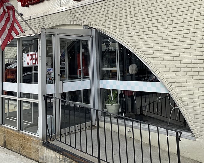 The neon glow of Victor's 50's Diner sign beckons like a time machine disguised as a restaurant. Hudson's retro gem promises comfort food that'll make your cardiologist wince and your soul sing.