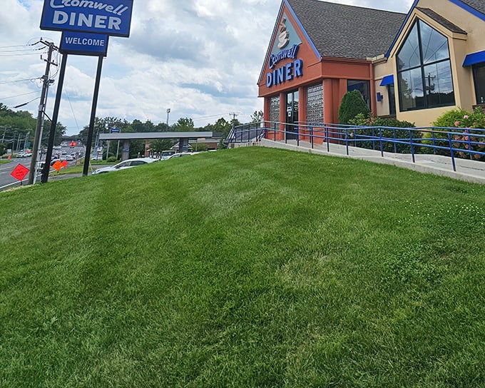 The iconic blue sign of Cromwell Diner stands like a beacon for hungry travelers, promising comfort food salvation just off Route 372.