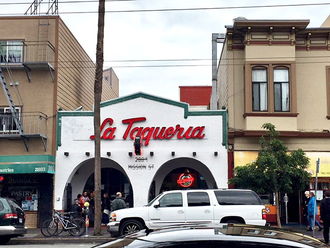 The iconic white facade with its distinctive red script beckons hungry pilgrims like a taco temple. Those arches aren't just decorative—they're gateways to burrito bliss.