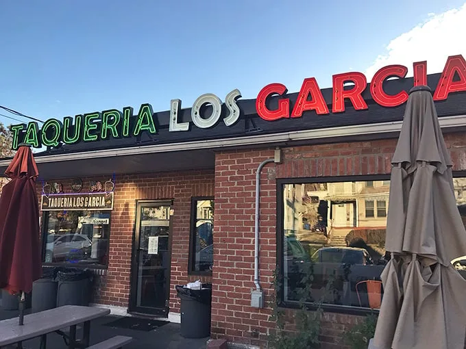 The colorful exterior of Los Garcia beckons hungry patrons with its vibrant sugar skull artwork and Mexican flag colors. Worth the wait in any weather!