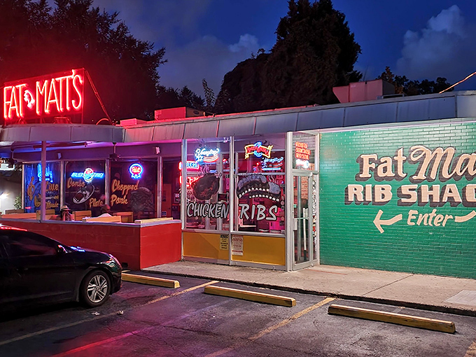 The neon "FAT MATT'S" sign glows like a barbecue beacon against the twilight sky, promising smoky salvation to hungry Atlanta souls.