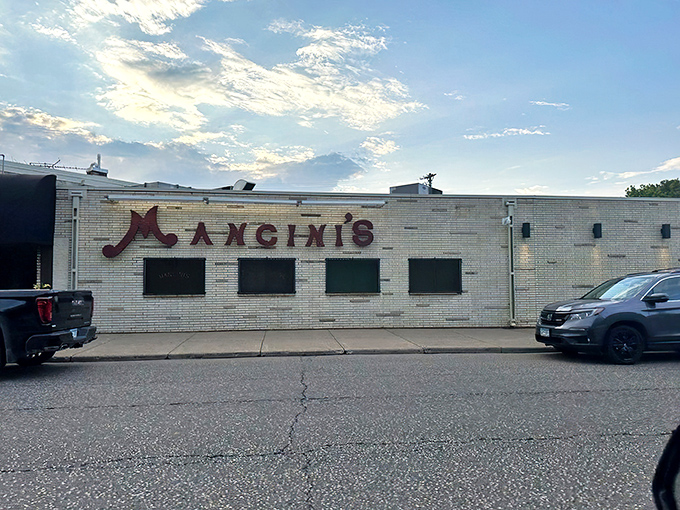 That vintage neon sign isn't just advertising – it's a time machine promising cocktails, steaks, and an evening where calories don't count.