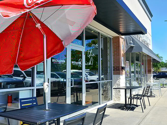 The unassuming storefront of Brick & Spoon might fool you, but those packed parking spaces tell the real story—breakfast treasures await inside.