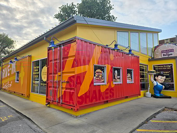Welcome to burger paradise! Hi-Pointe Drive-In's whimsical exterior, complete with a giant burger sculpture, promises the kind of meal that makes grown adults giggle with anticipation.