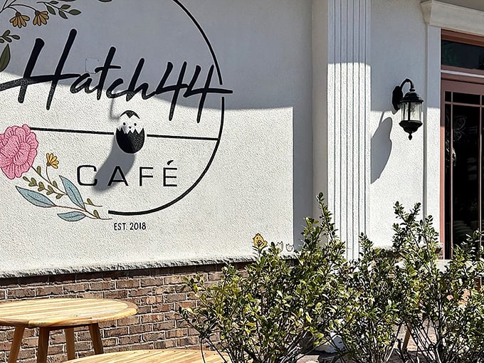 Hatch44's pristine white exterior with striped awnings isn't just inviting—it's practically winking at you to come inside for breakfast magic.