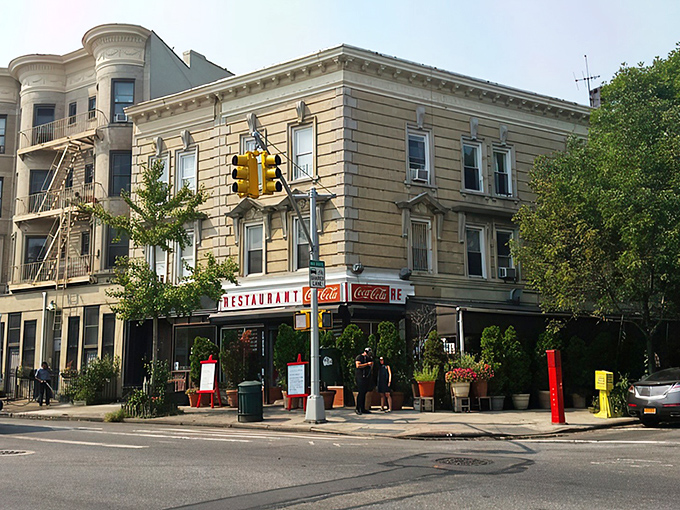 That classic corner storefront isn't just architectural eye candy—it's a beacon of breakfast hope on Washington Avenue, promising pancake nirvana inside.