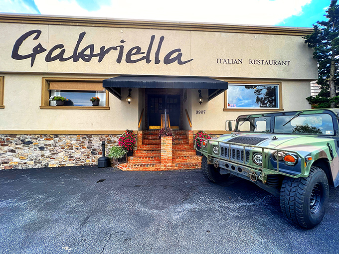 The unassuming exterior of Gabriella welcomes you with classic brick steps and that military-grade Humvee—clearly someone takes their garlic bread defense seriously!