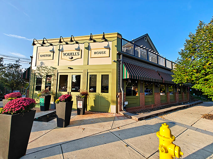 The cheerful yellow exterior of Youell's Oyster House stands like a beacon of seafood hope in landlocked Allentown. Those flower planters aren't just pretty—they're a promise of good things to come.