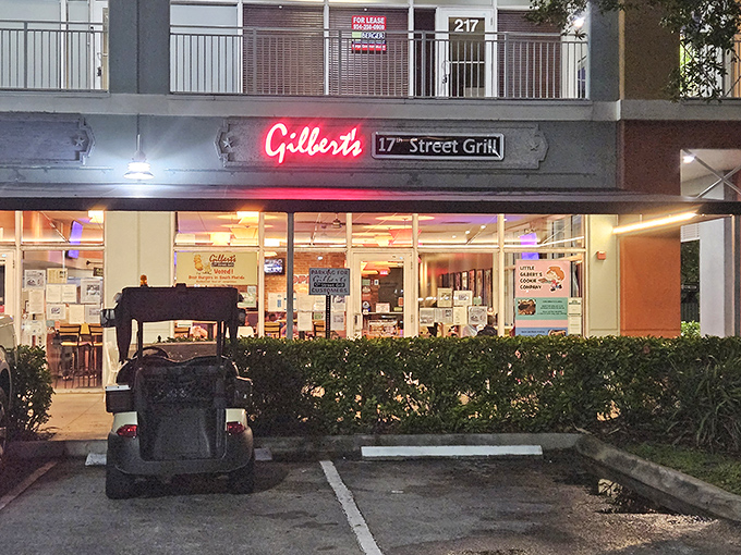 The neon glow of Gilbert's sign beckons hungry travelers like a culinary lighthouse in a sea of chain restaurants.