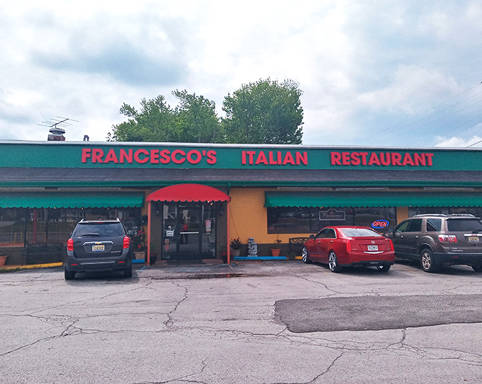 The cheerful yellow exterior with its red and green awnings isn't just inviting—it's practically shouting "authentic Italian food inside!" like a culinary town crier.