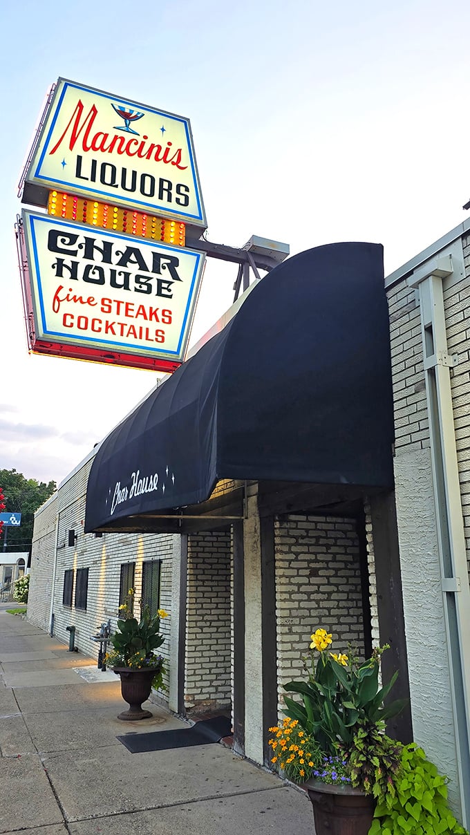 That vintage neon sign isn't just advertising – it's a time machine promising cocktails, steaks, and an evening where calories don't count.