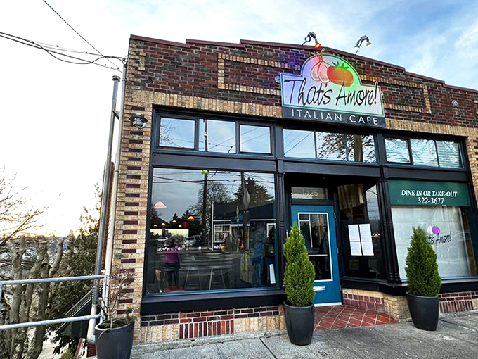 That neon tomato sign isn't just winking at you—it's inviting you into a brick-fronted paradise where pasta dreams come true.