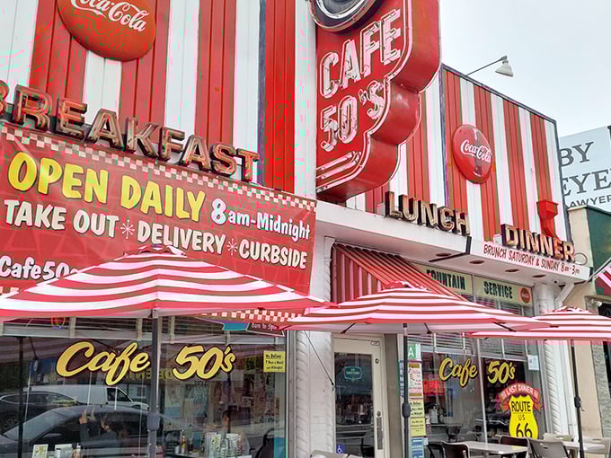 The iconic red and white striped façade of Cafe 50's beckons like a time portal on Santa Monica Boulevard. It's not just a meal—it's a journey.