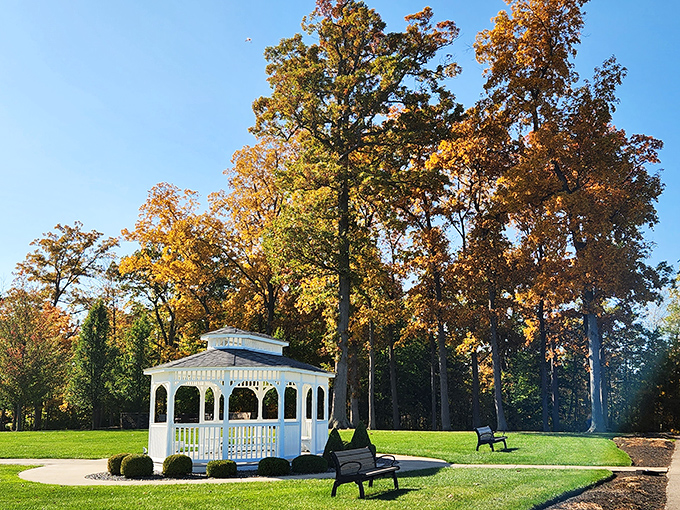 Lake Erie's moody blues meet architectural charm at this picturesque gazebo, where visitors gather to witness nature's daily watercolor masterpiece.