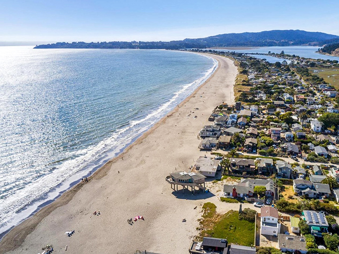 Paradise from above! Stinson Beach's three-mile crescent of golden sand hugs the coastline like nature's perfect smile, with Mount Tamalpais standing guard in the background.