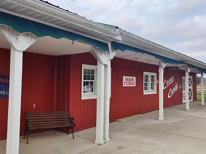 The iconic red exterior of Coons Candy beckons like a barn-sized treasure chest. Even the "FRESH FUDGE" sign seems to whisper sweet promises from across the parking lot.