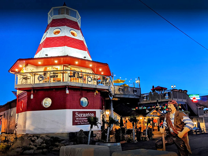The lighthouse at Cooper's isn't guiding ships—it's beckoning hungry travelers to a seafood oasis in landlocked Scranton. Maritime magic awaits!