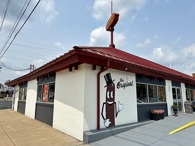 That cheerful hot dog mascot on the building isn't just decoration – it's a promise of deliciousness delivered daily.