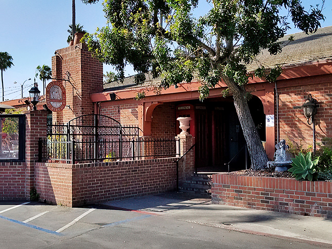 The brick exterior of Gulliver's stands like a time portal to old England, complete with wrought iron fencing and California sunshine playing peekaboo through the trees.