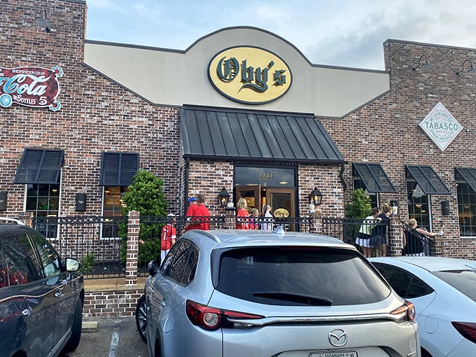 Oby's brick exterior welcomes hungry visitors with its iconic oval sign—like a beacon of sandwich salvation in Oxford's culinary landscape.