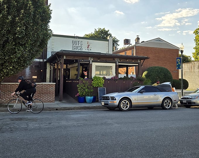 The unassuming white brick exterior of Dot's Back Inn belies the culinary treasures within. Like finding a $20 bill in last year's winter coat—unexpected joy awaits.