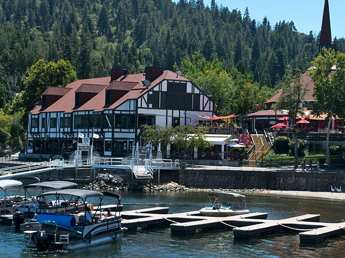 The crystal-clear waters of Lake Arrowhead meet charming Tudor-style architecture, creating a postcard-perfect scene that whispers "European vacation" without the passport hassle.