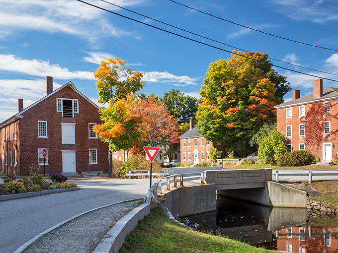 Storybook perfection isn't Photoshopped here—Harrisville's historic buildings embrace the millpond like old friends catching up after a long winter.