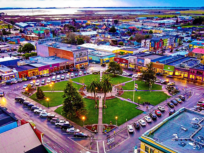 Arcata's downtown plaza glows at dusk, a perfect square of green surrounded by colorful Victorian buildings – California's small-town charm dialed up to eleven.