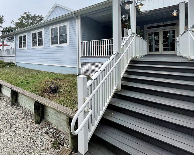 The coastal charm of Aunt Kate's welcomes you with its pale blue exterior and inviting staircase—Florida's version of a seafood welcome mat.