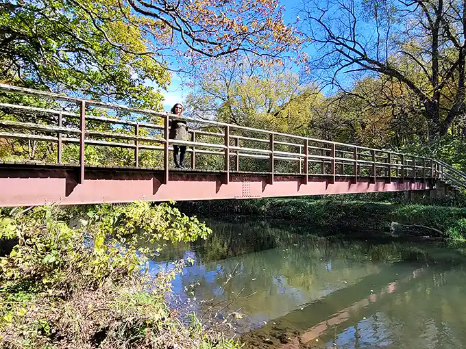 The stone bridge at White Pines stands like a miniature medieval fortress, where hiking trails and daydreams converge above Pine Creek's gentle flow.