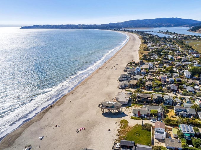 Paradise from above! Stinson Beach's three-mile crescent of golden sand hugs the coastline like nature's perfect smile, with Mount Tamalpais standing guard in the background.