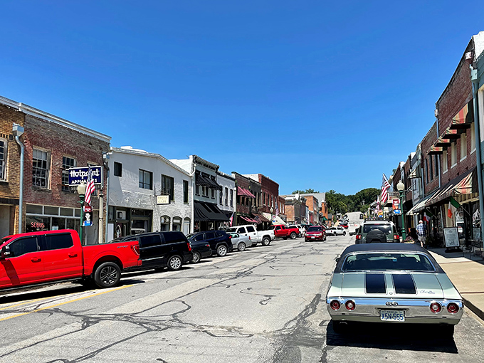 Main Street Weston whispers stories of riverboat days while modern cars line up like patient time travelers waiting their turn.